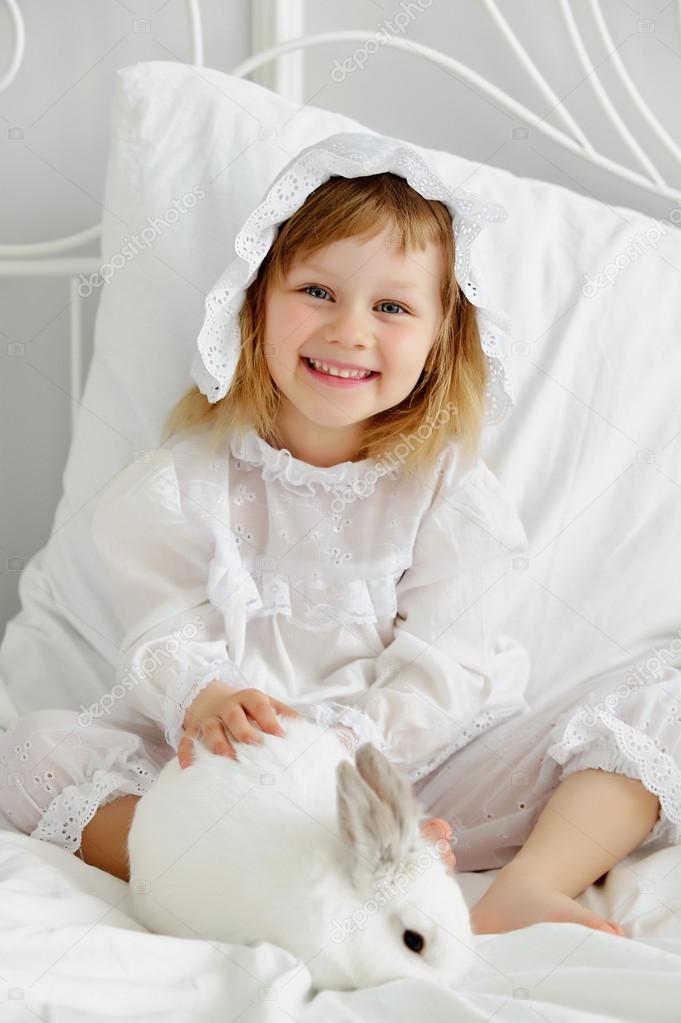 Little girl with a rabbit Stock Photo by ©fotofocus18.gmail.com 109834152