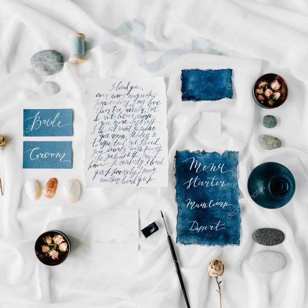 Flat lay wedding invitation cards Stock Photo by ©maximleshkovich 117597908