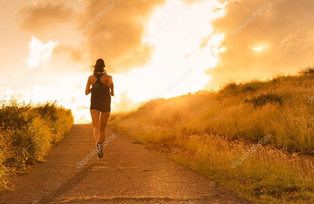 Female running at sunset. — Stock Photo © kieferpix #105889658
