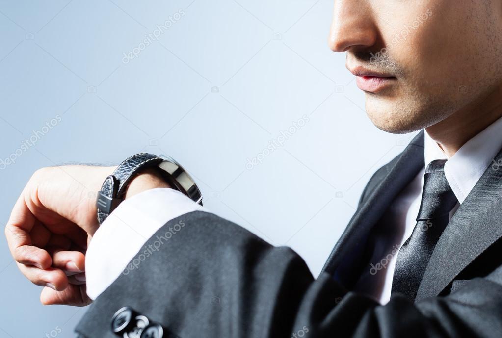 Businessman looking at watch — Stock Photo © kieferpix #106401700