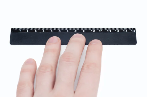 Hands hold a black ruler isolated with a white background. — Stock ...