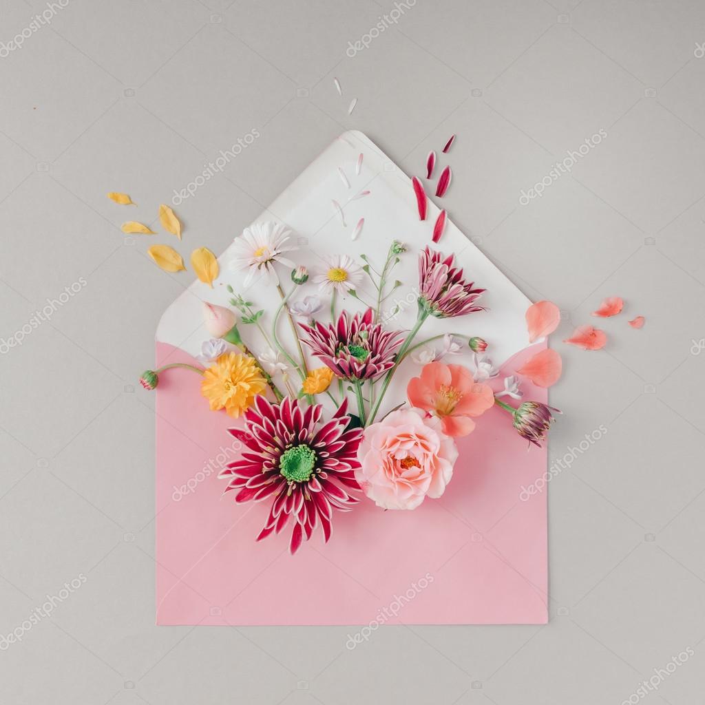 Pink envelope full of various flowers — Stock Photo © Zamurovic #106311356