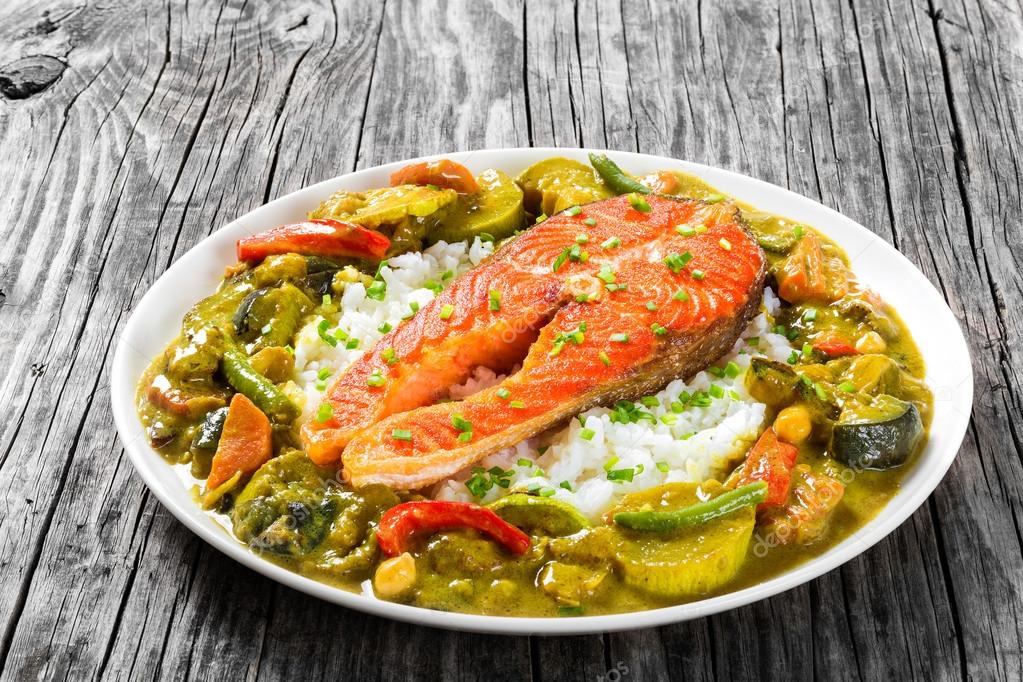 Fried steak of red fish with rice and homemade curry — Stock Photo ...