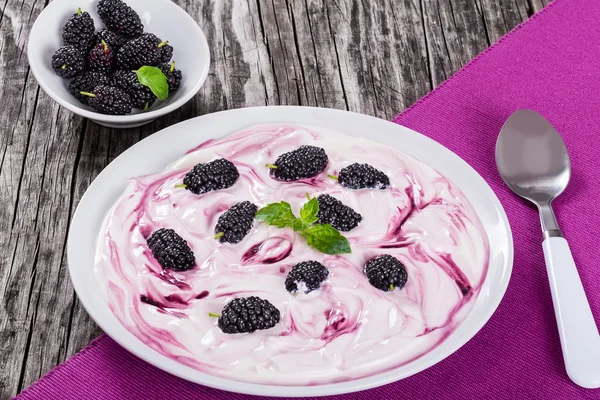 Fresh greek colored stains yogurt with berries in glass cup Stock Photo ...