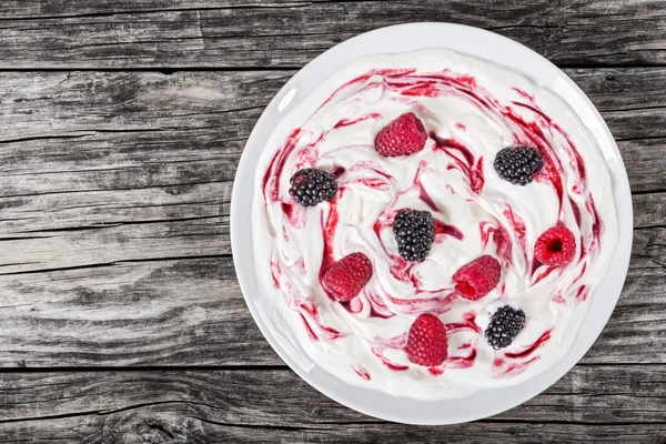Fresh greek colored stains yogurt with berries in glass cup Stock Photo ...