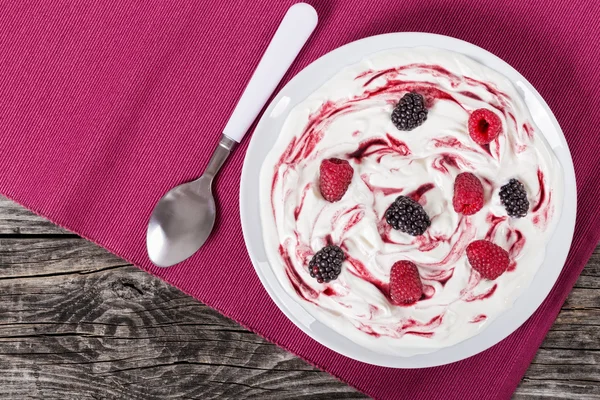 Fresh greek colored stains yogurt with berries in glass cup Stock Photo ...