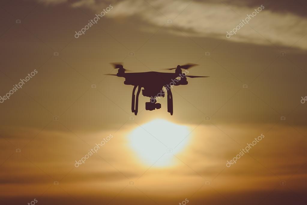Flying drone at sunset — Stock Photo © Afotoeu #111958154