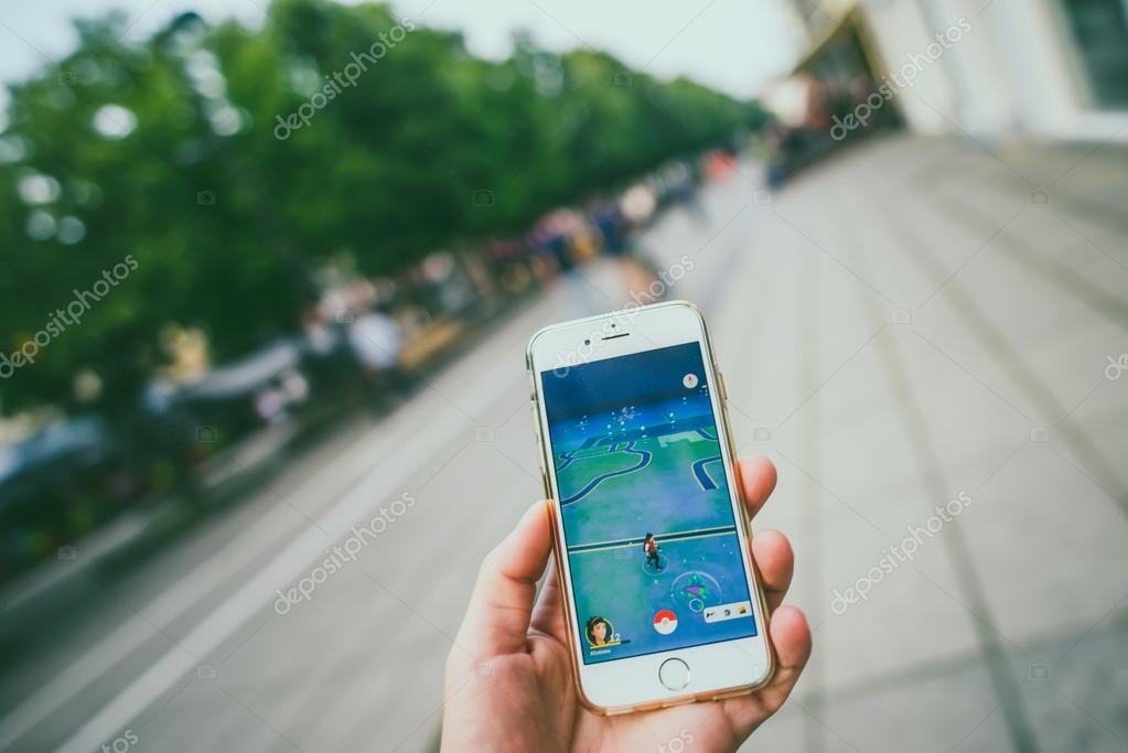 Pokemon Go game on city background – Stock Editorial Photo © Afotoeu ...