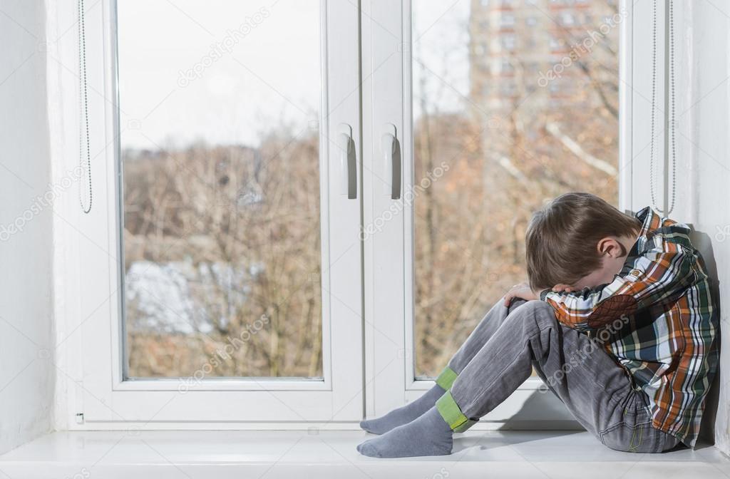 Kid sitting in window Stock Photo by ©upslim 105950284