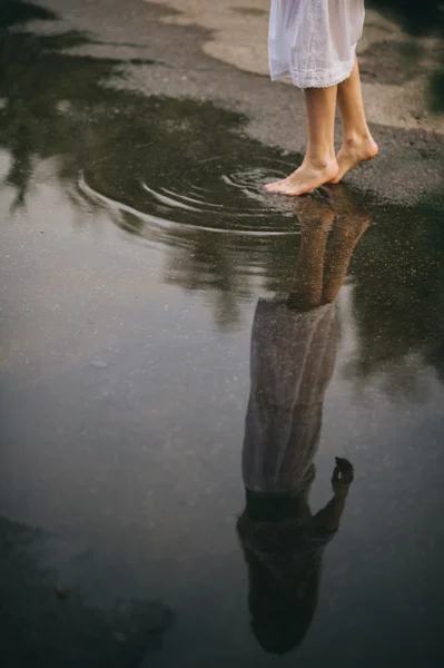 Woman walking barefoot through puddle — Stock Photo © Photo_life #106485212 Woman walking barefoot through puddle — Stock Photo © Photo_life #106485212