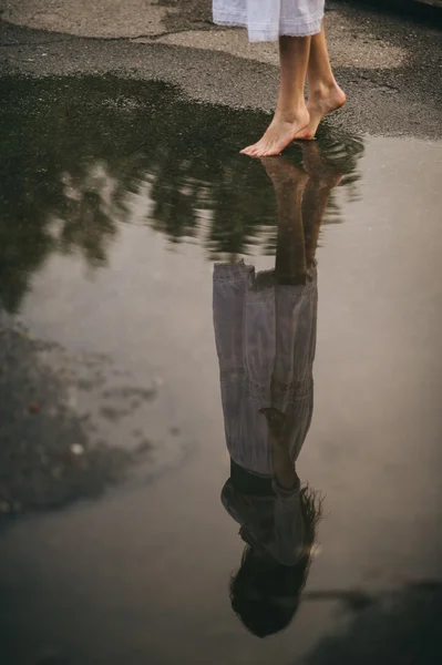 Puddle woman Images - Search Images on Everypixel