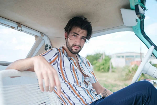 portrait of beautiful dark-haired italian model man with light eyes ...
