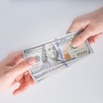 Several hands stretch of banknotes Stock Photo by ©SergeyNivens 4504883