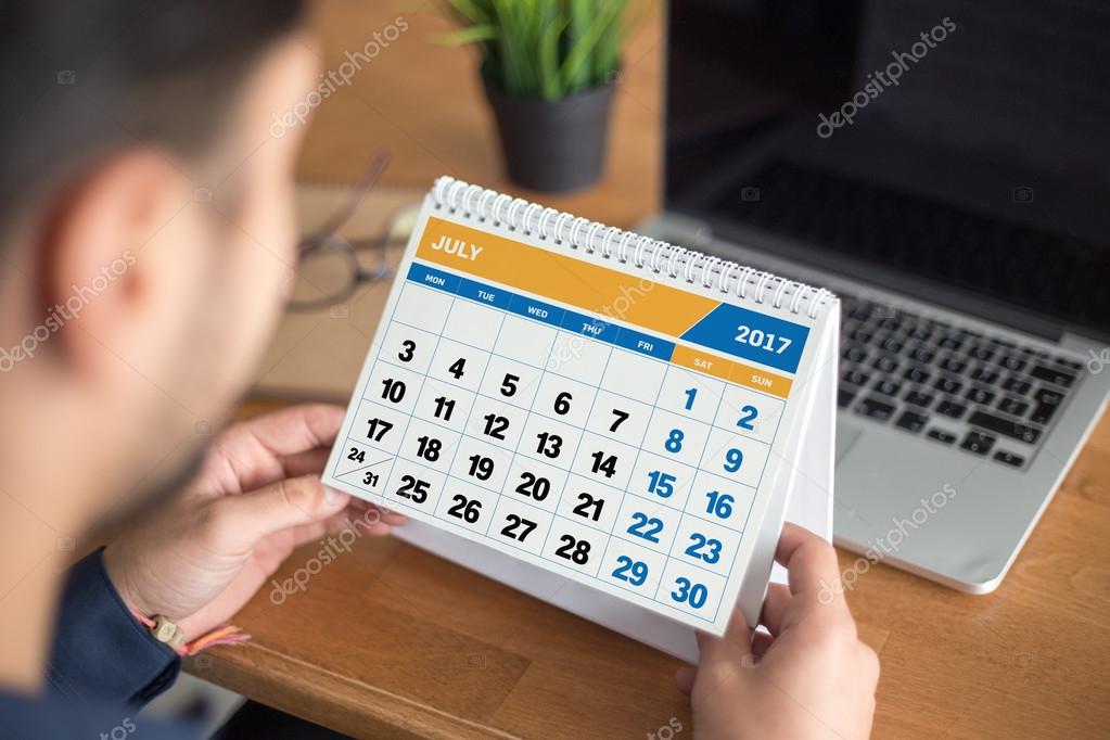 Businessman checking appointments in the calendar 2017 — Stock Photo ...