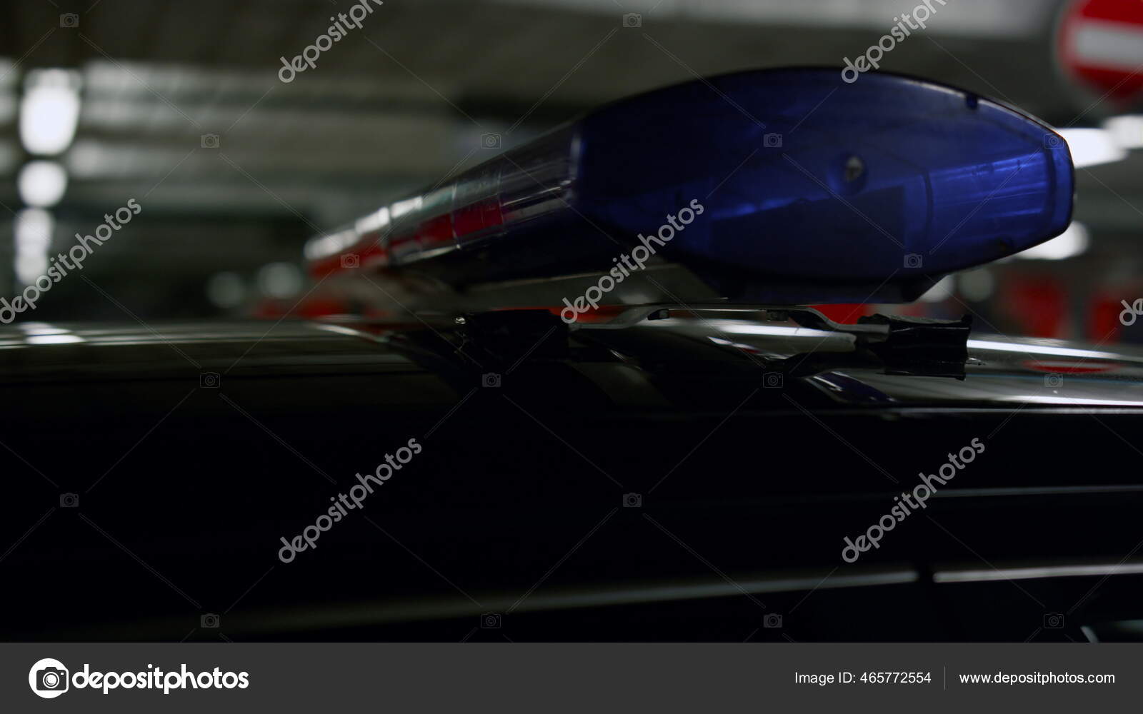 Red and blue lights glowing on police car. Siren lighting on roof of ...