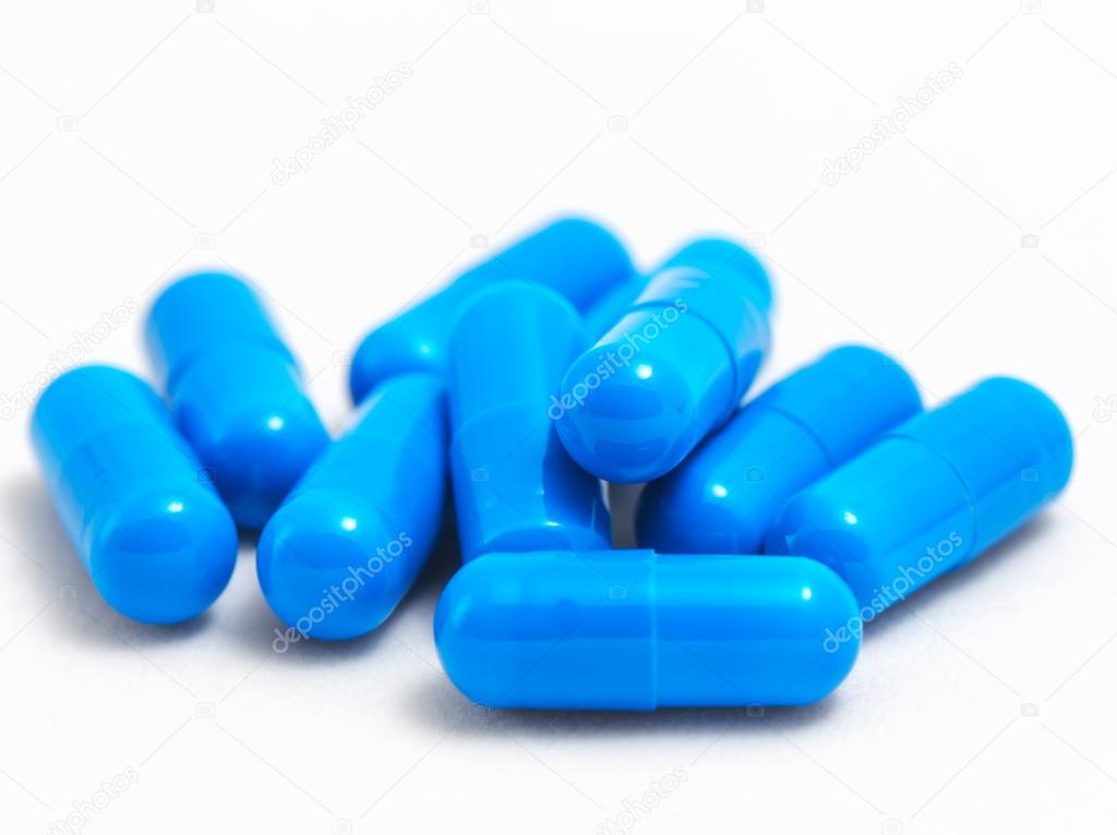 A bunch of blue pills on white. — Stock Photo © viki2103stock #106860110