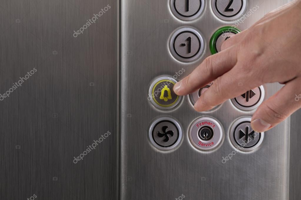 Hand pressing the alarm button in the elevator — Stock Photo © Zoff ...