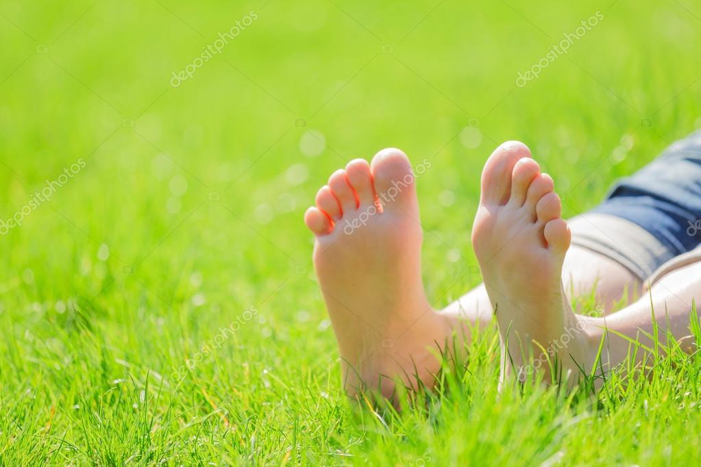 Female bare feet on grass Stock Photo by ©OlyPhotoStories 107698750
