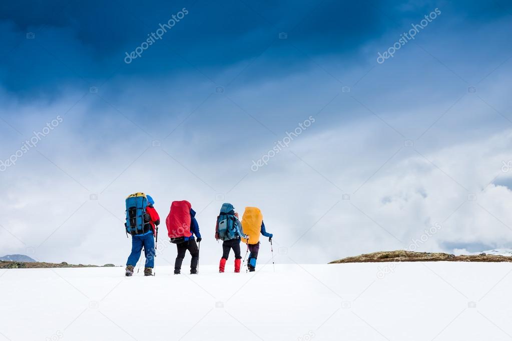 Hikers team in the mountains — Stock Photo © OlyPhotoStories #110312434