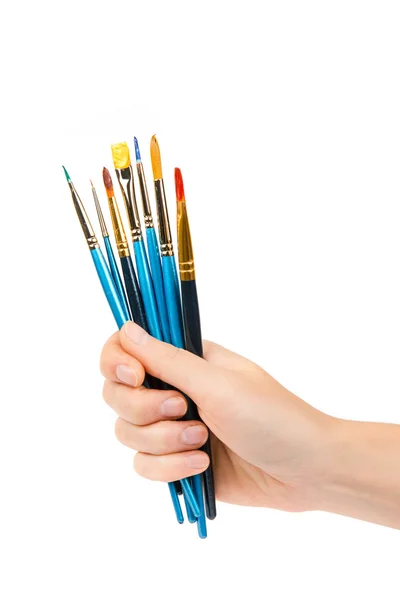 Hand holding paint brushes — Stock Photo © OlyPhotoStories #111789986