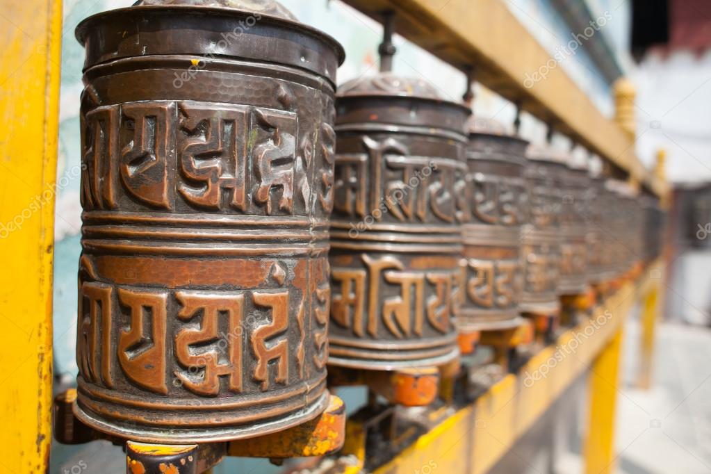 Tibetan prayer wheels or prayers rolls of the faithful Buddhists ...