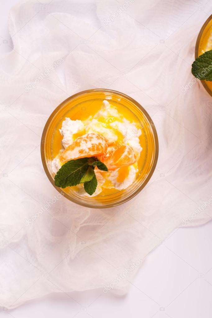Layered panna cotta with whipped cream and tangerine sauce Stock Photo ...