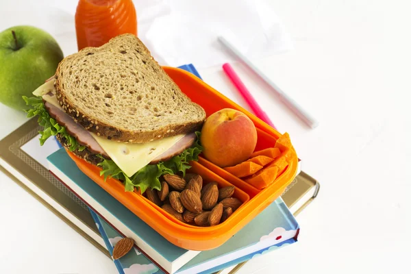 School lunch box with sandwich, fruits and nuts - Stock Image - Everypixel