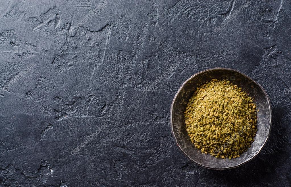 Mixed east spice - zaatar or zatar in metal vintage bowl on dark stone ...