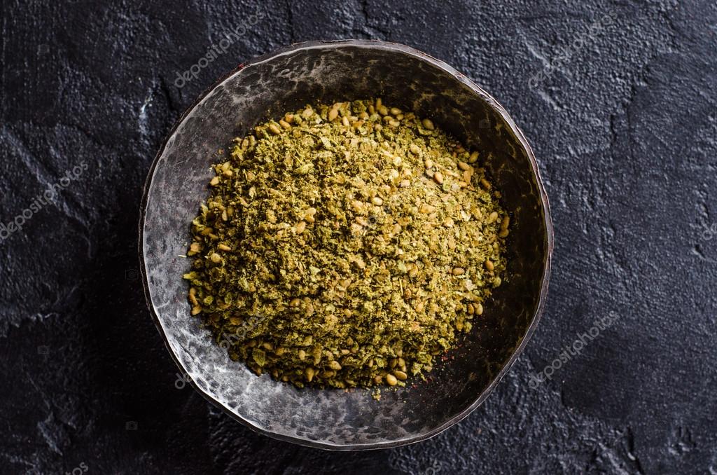 Mixed east spice - zaatar or zatar in metal vintage bowl on dark stone ...