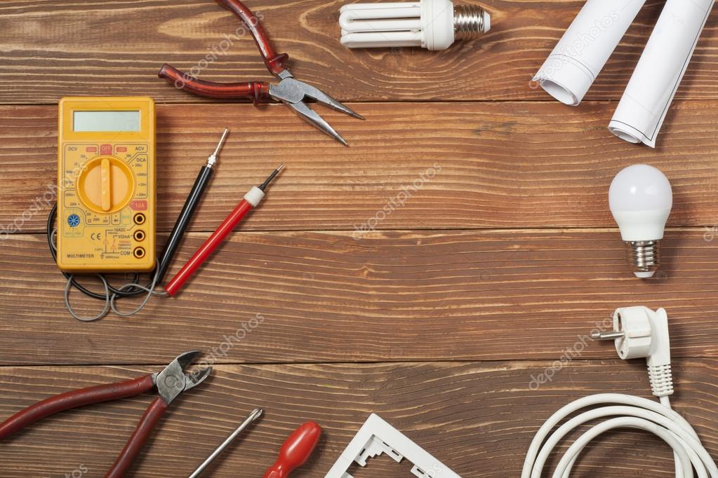 Set of electrical tool on wooden background. Accessories for ...