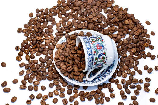 coffee cup full of coffee grains on white table - Stock Image - Everypixel