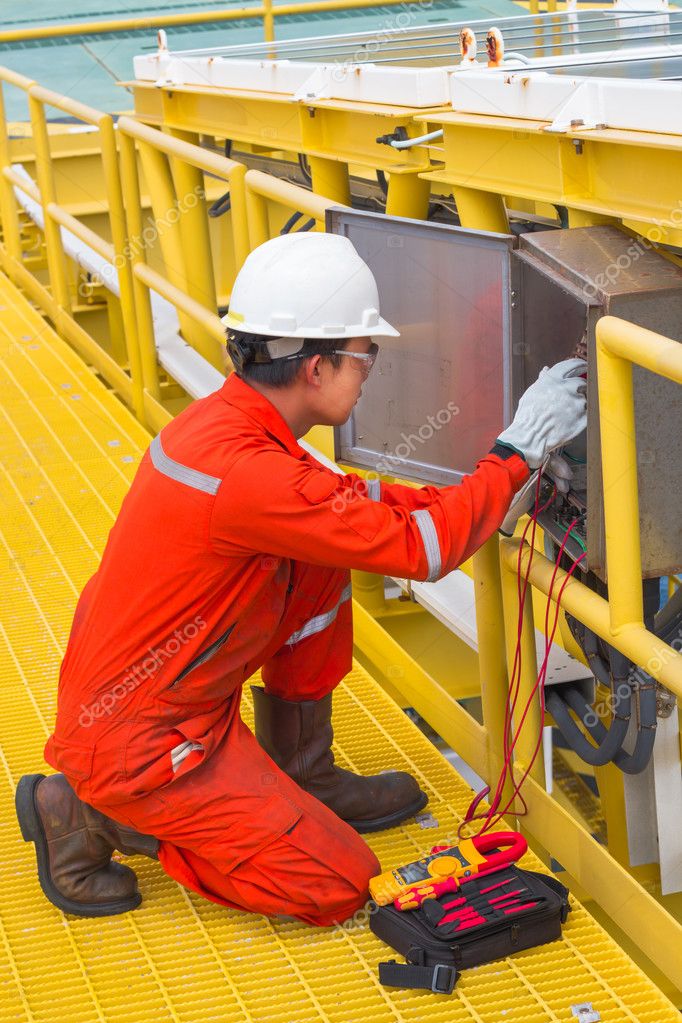Electrician using the digital multimeter Stock Photo by ©Xmentosys ...