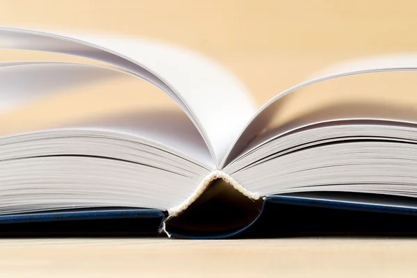 Open hardback book on wooden table. Back to school. Copy space - Stock ...