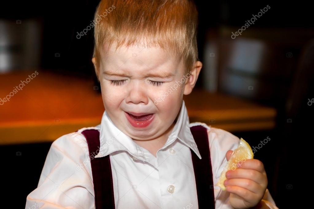 Little Boy Sour Lemon Face Stock Photo by ©jbrown777 112682018