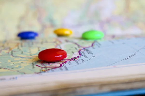 Travel destination points on a map indicated with colorful thumbtacks ...