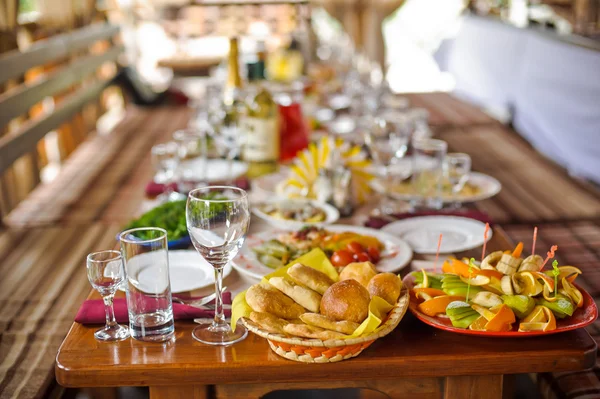 Table covered with a rustic meal - Stock Image - Everypixel