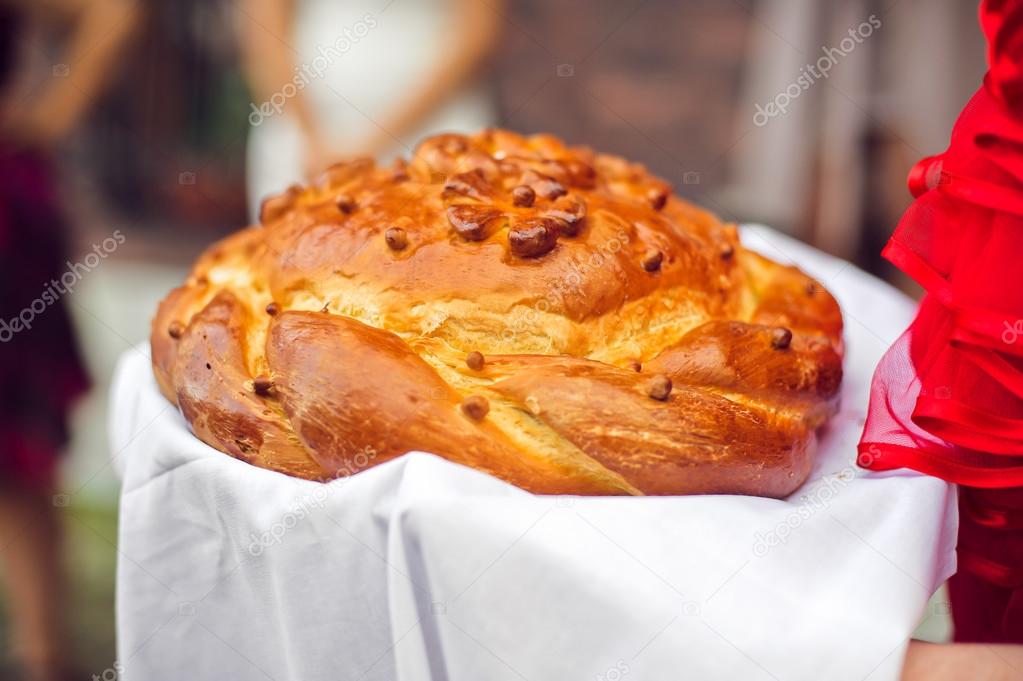 A traditional ritual of offering bread and salt to a welcome guest ...