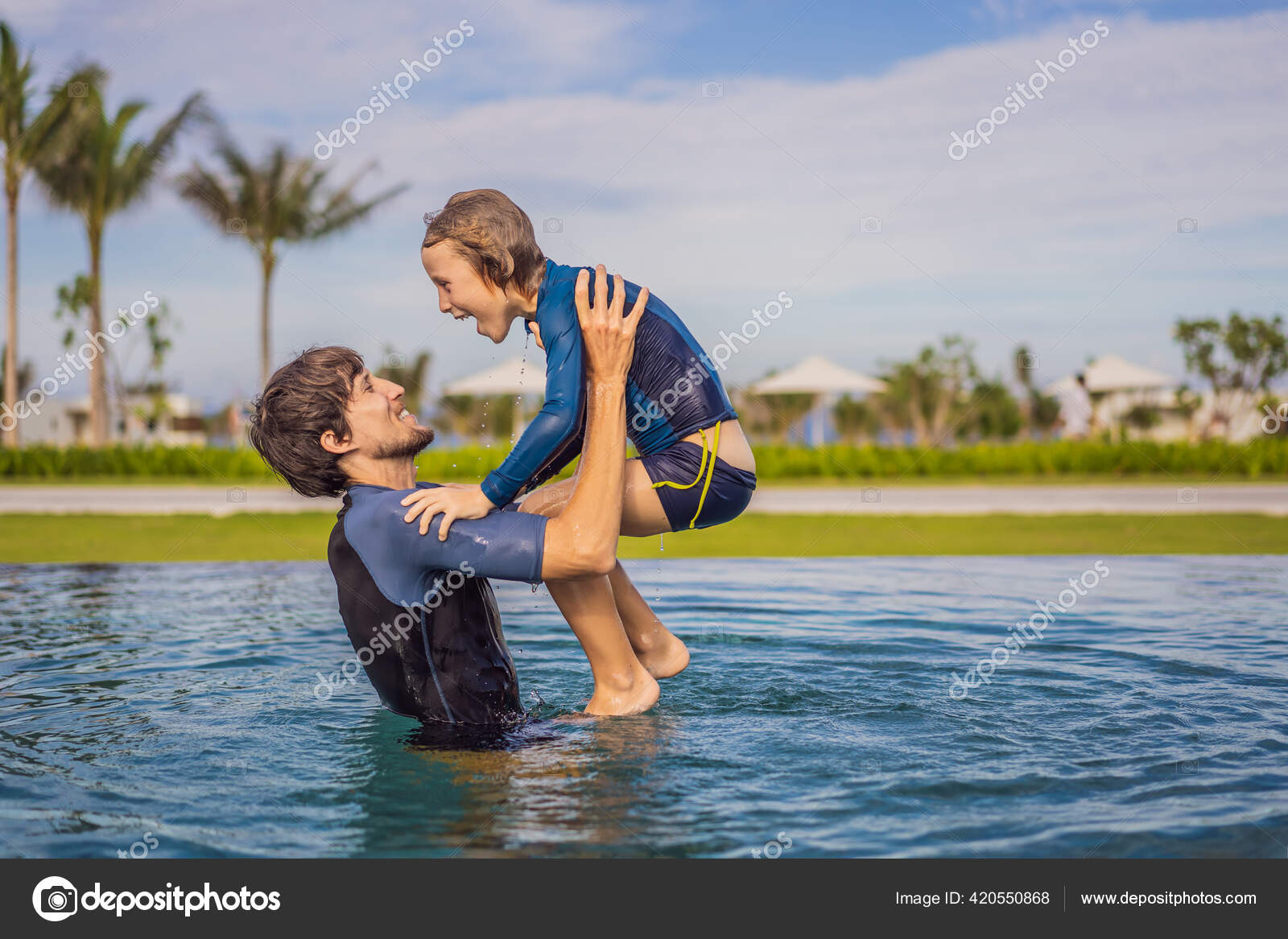 Father and Son having fun in the swimming pool — Stock Photo ...
