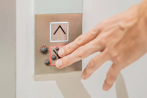 Hand finger press button in elevator with virus. Covid-19 or ...