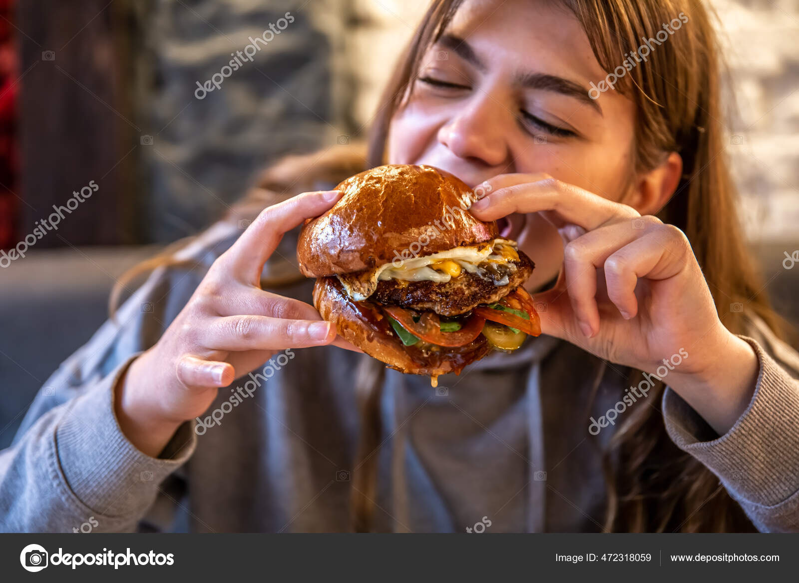 Female Eating Big Burger