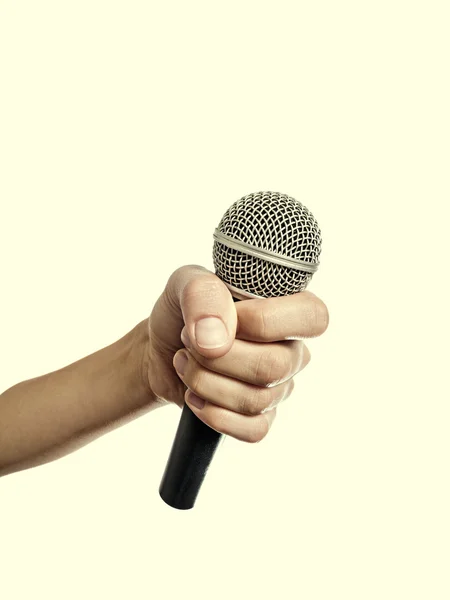 Bare hand holding microphone Stock Photo by ©OtnaYdur 11071861