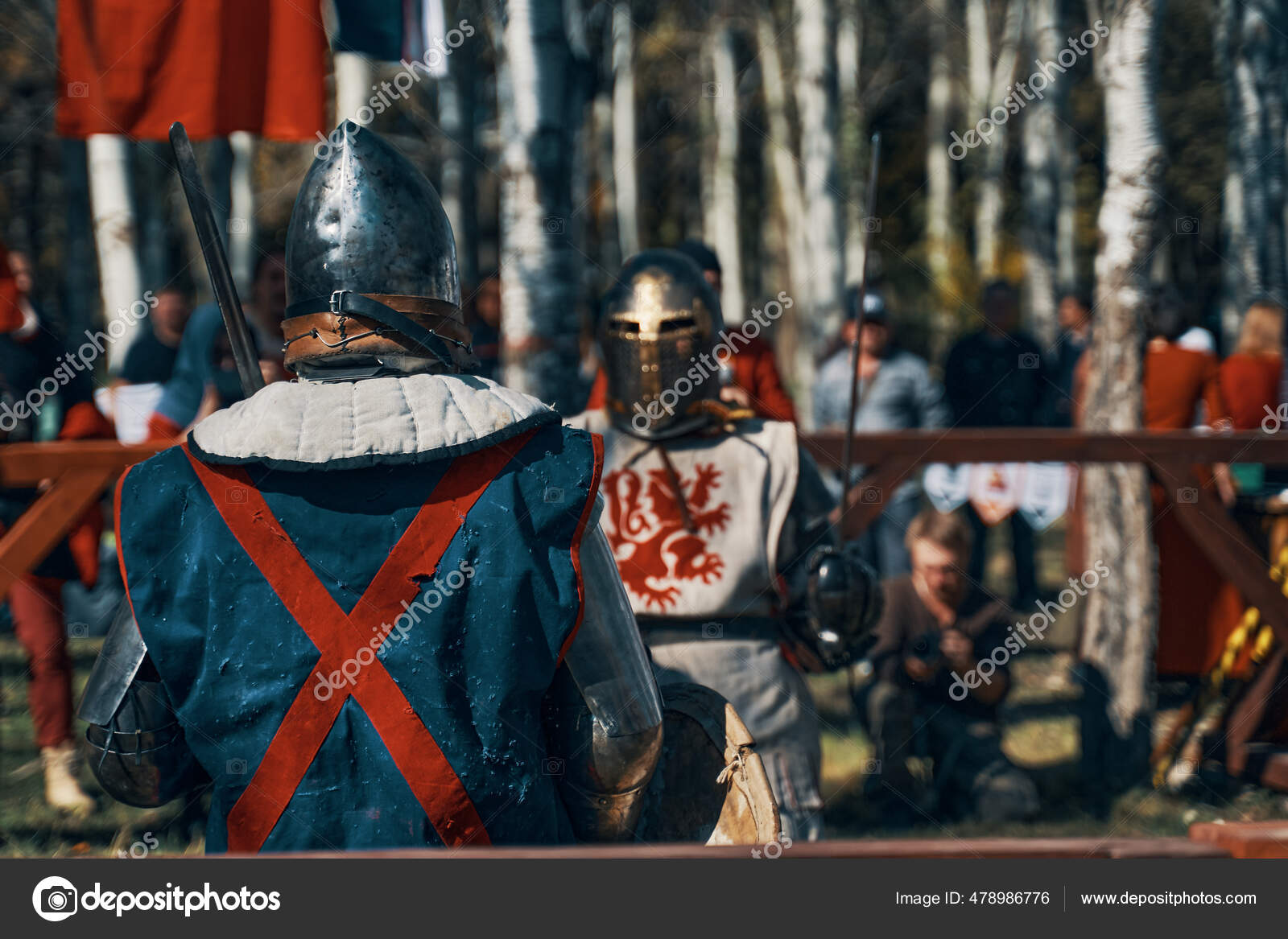 Two knights fight with swords in front of the audience. — Stock ...