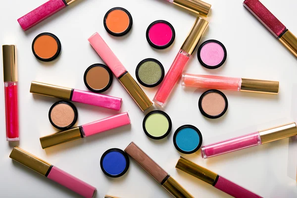 Make-up eye shadows with lip gloss. View from above. Flat lay - Stock ...