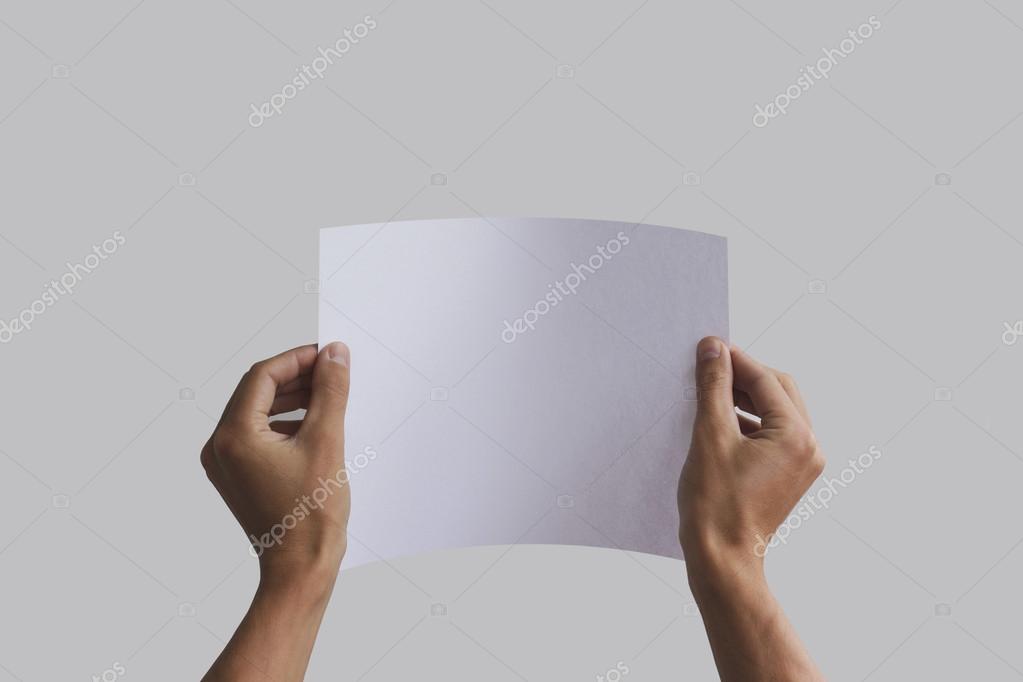 Hand holding curved A4 paper in the hand. Leaflet presentation. Stock ...