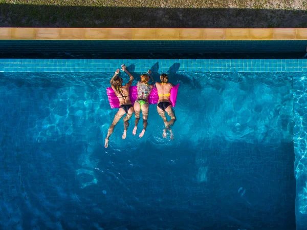 Guys have fun at pool - Stock Image - Everypixel
