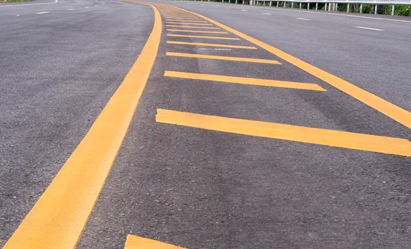 The curve Road and the yellow traffic lines. - Stock Image - Everypixel
