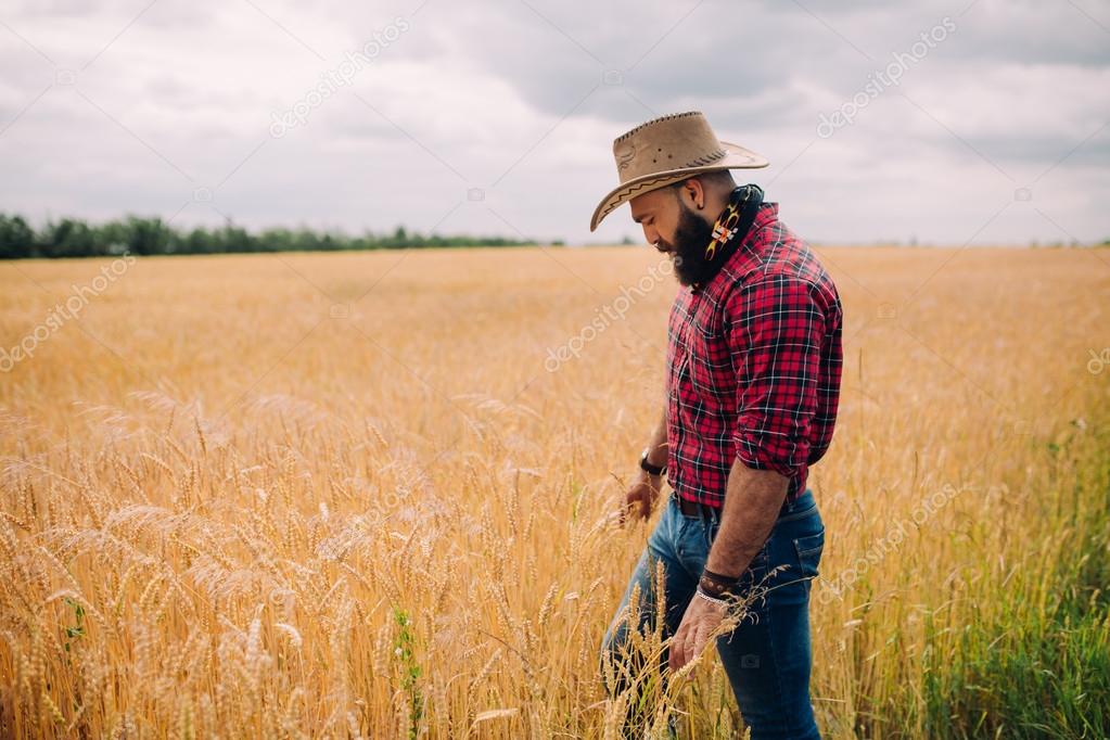 Bearded man in field Stock Photo by ©anatoliycherkas 121089030