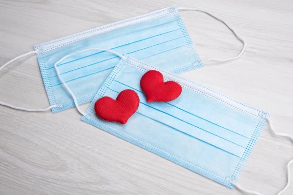 Red heart on medical face masks. Concept support, love, care and a ...