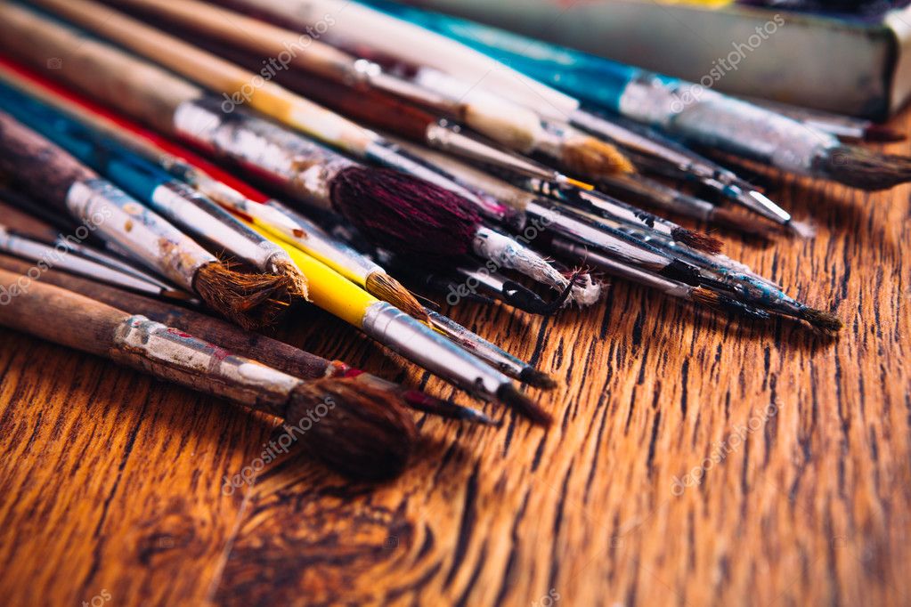 Many brushes for painting on wooden background — Stock Photo ...