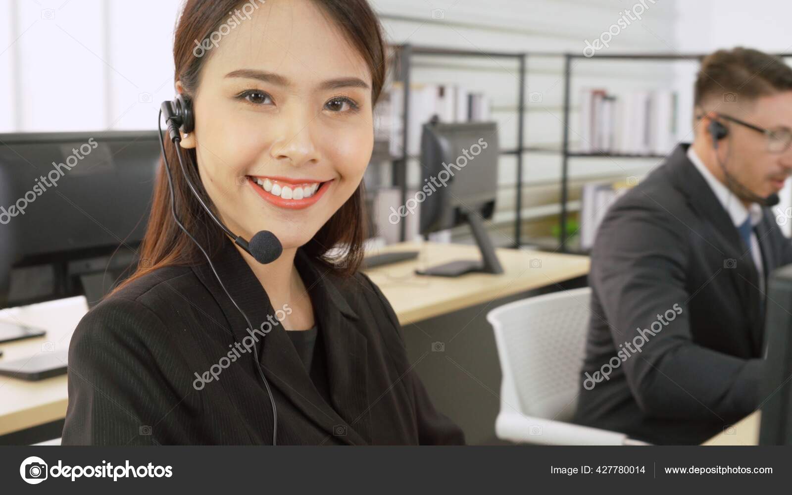 Business people wearing headset working in office — Stock Photo ...